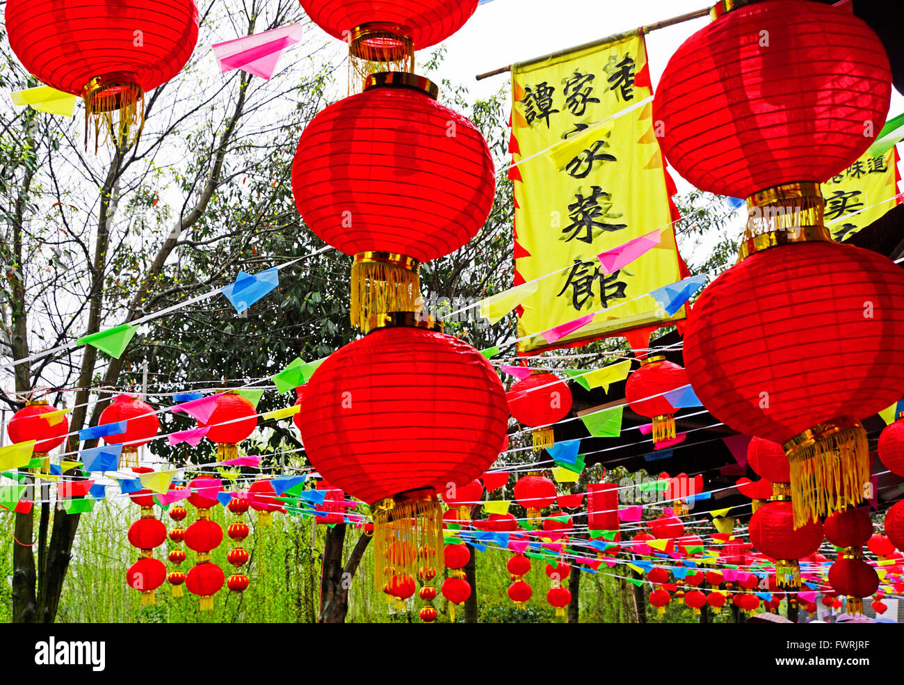 Chinese lanterns and flags decorating street in Jing Gang Ancient ...