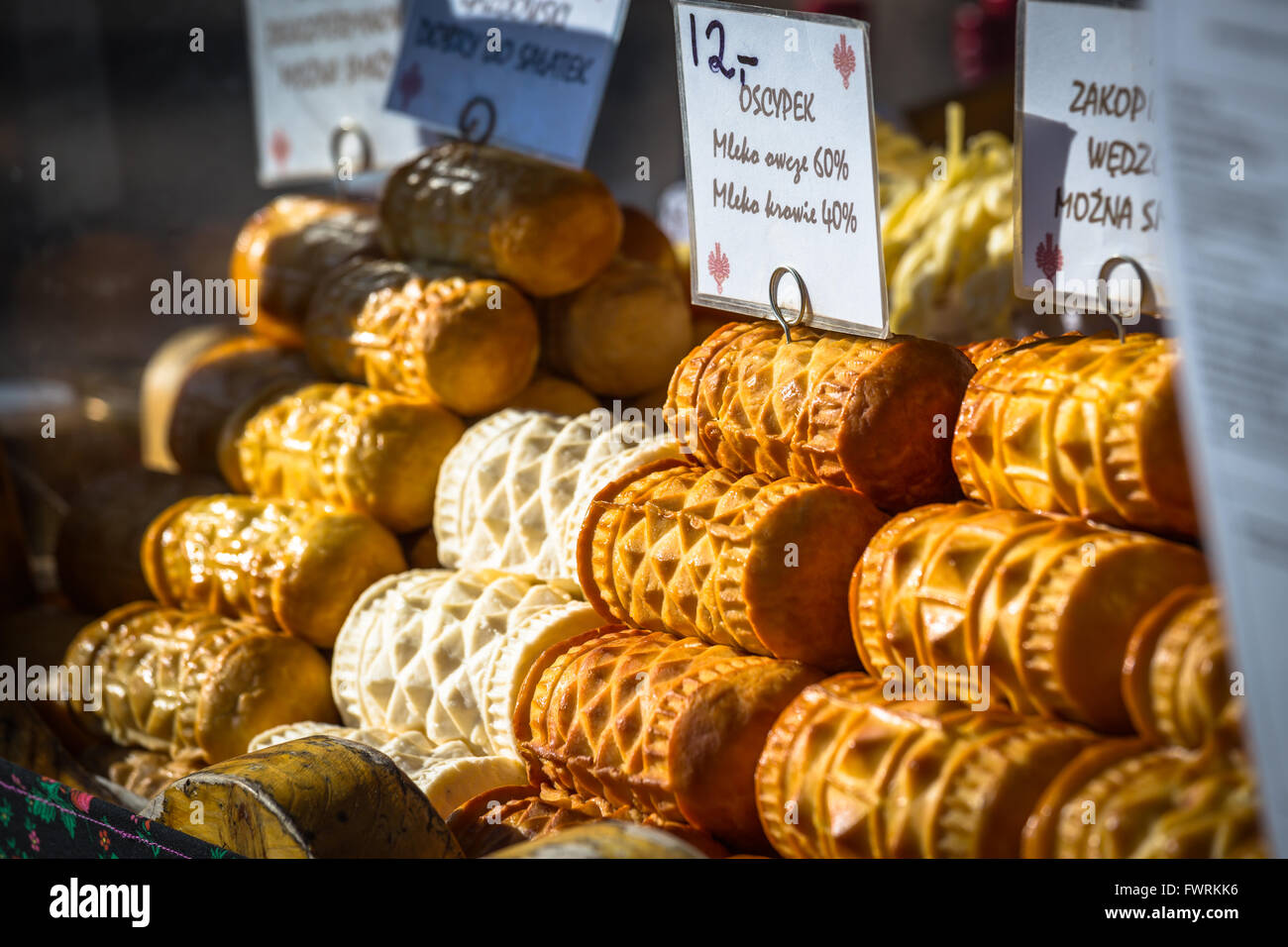 Traditional polish smoked cheese oscypek on outdoor market in Zakopane ...
