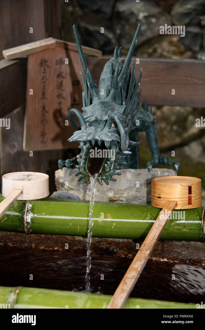 A dragon water feature at a Shinto shrine in Nara, Japan Stock Photo ...