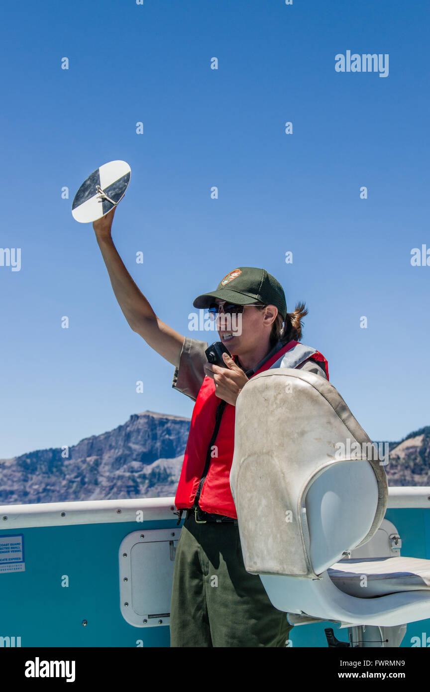 Park ranger demonstrating the use of a Secchi disk water clarity ...