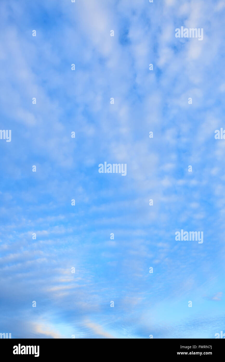 Calm sunset clouds and blue sky Stock Photo - Alamy