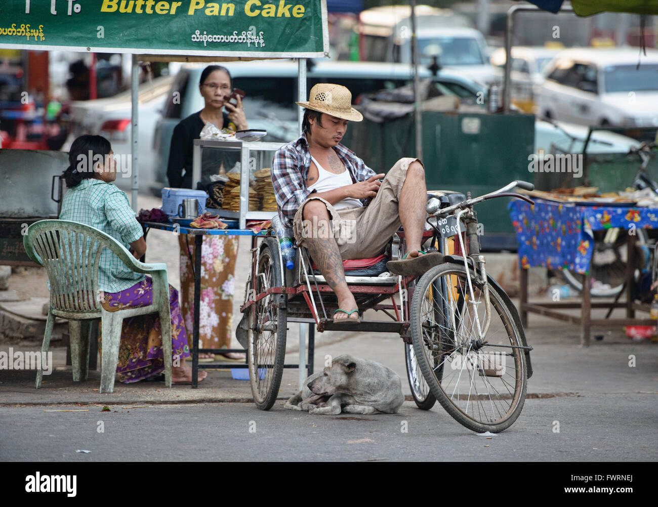 Rickshaw driver relaxing, Yangon, Myanmar Stock Photo - Alamy