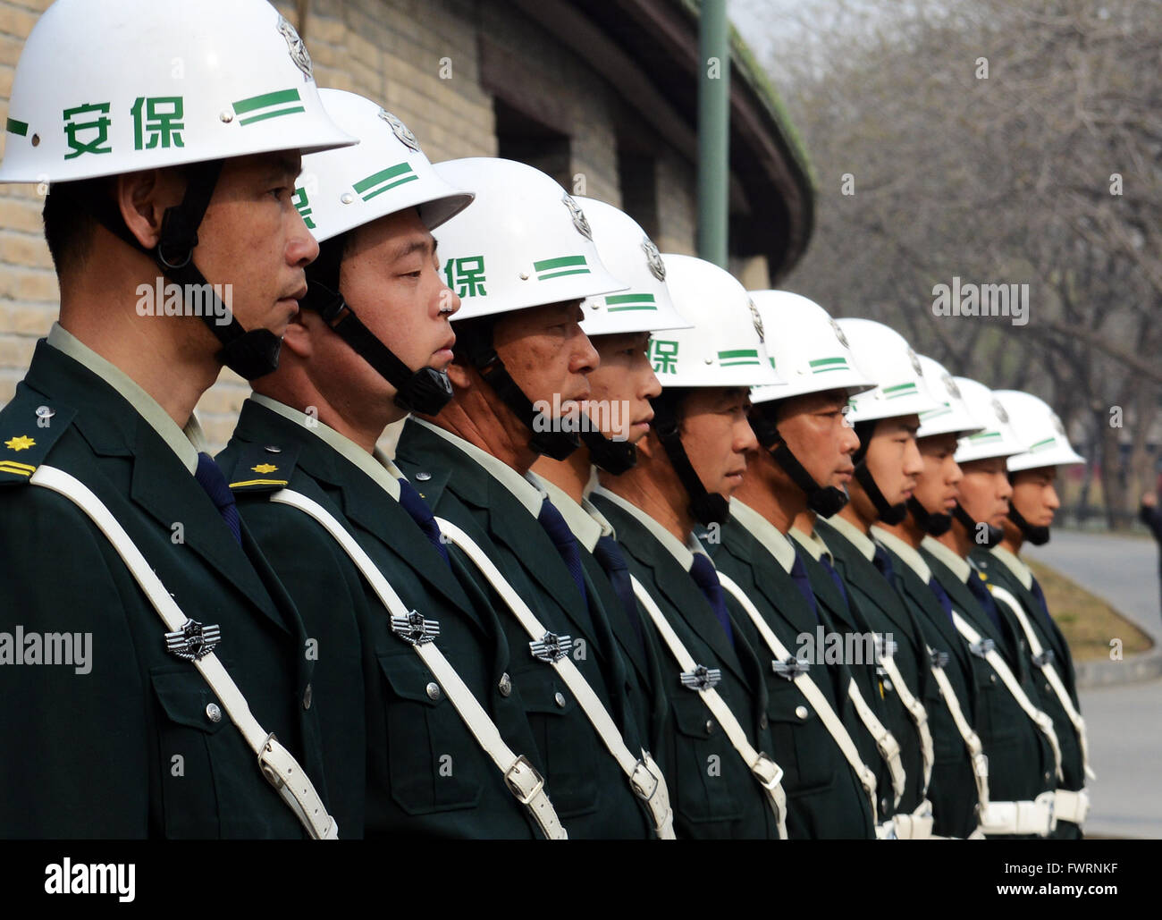 Chinese security forces standing in strait line during an order by ...