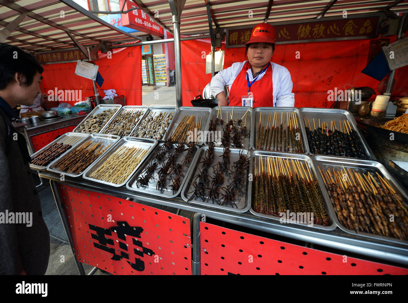 Skewered spiders, Scorpions, Larva and other bizarre insects sold in a ...