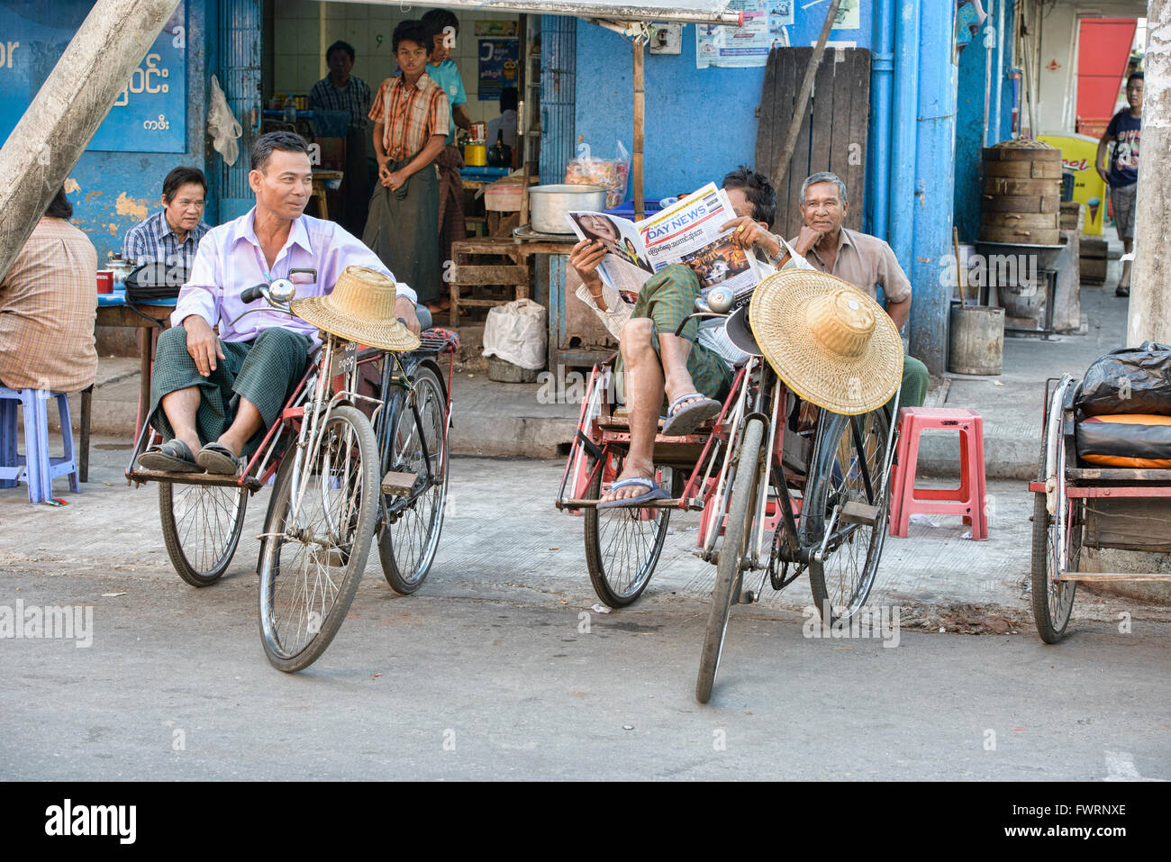 Rickshaw drivers relaxing, Yangon, Myanmar Stock Photo - Alamy