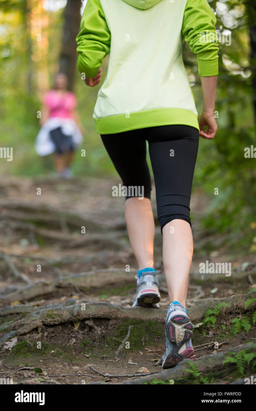 Female runner in the forest Stock Photo - Alamy