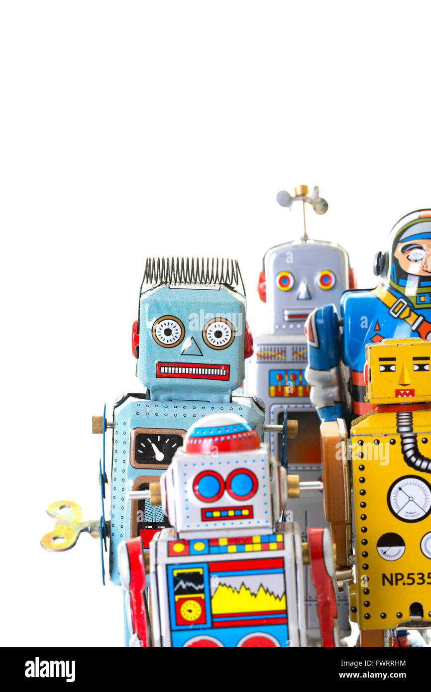 Collection of Retro Tin Clockwork Robots on a White Background with ...