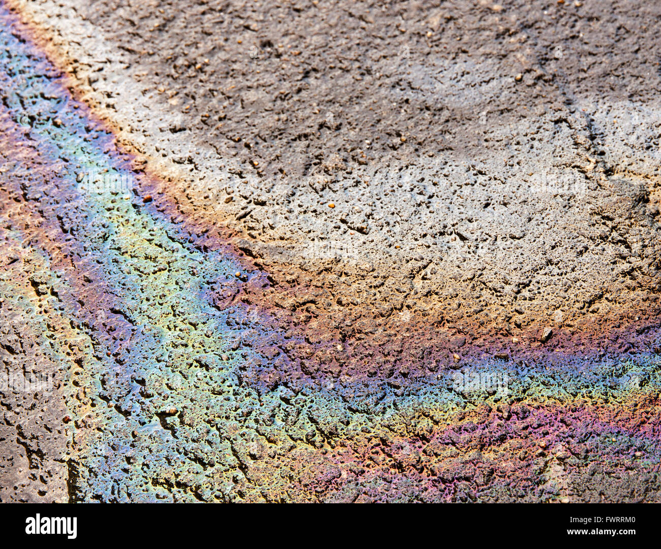 Oil on ground when wet cause rainbow on water on ground concrete Stock ...
