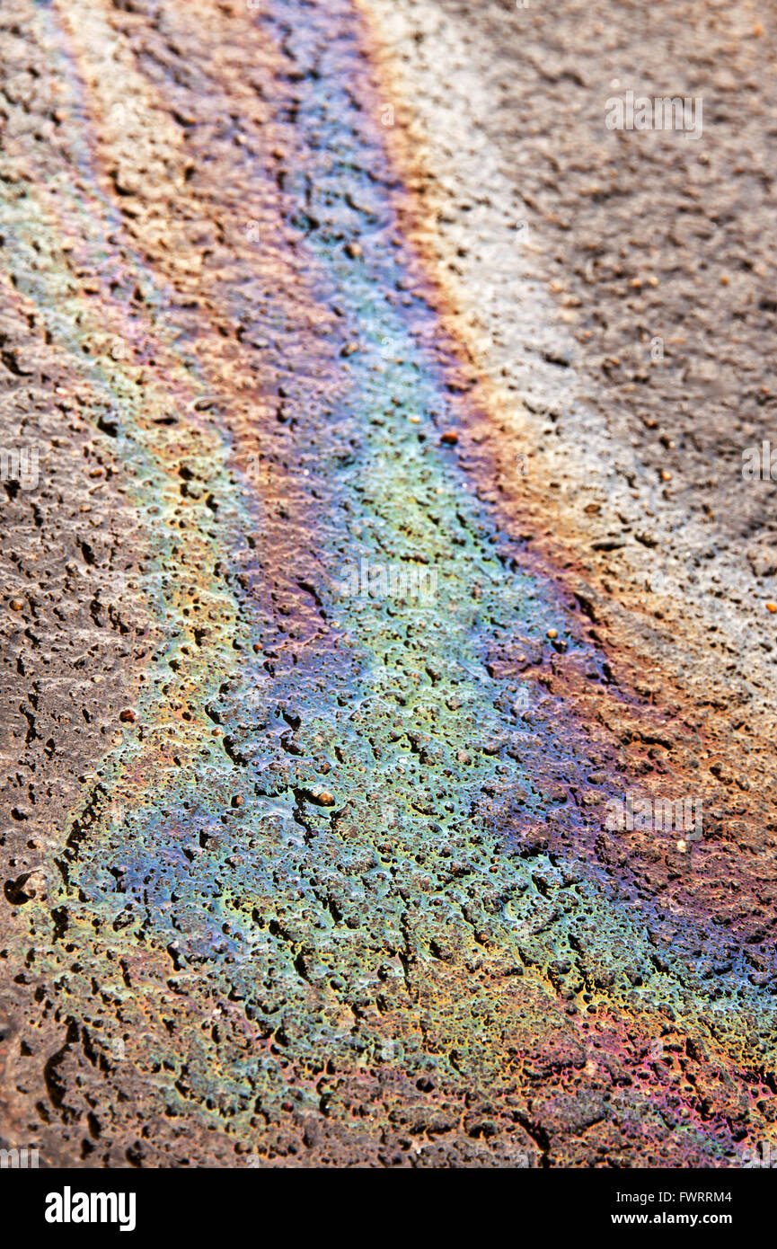 Oil on ground when wet cause rainbow on water on ground concrete Stock ...