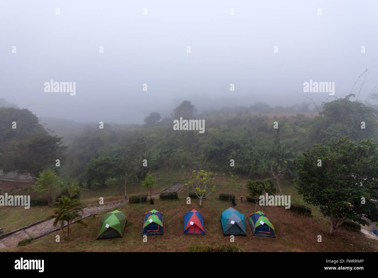 Tent camp atmosphere with early morning mist Stock Photo - Alamy