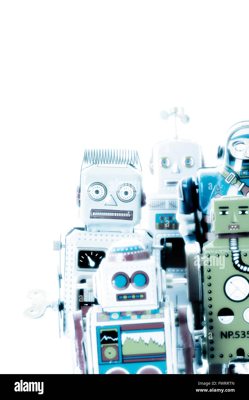 Collection of Retro Tin Clockwork Robots on a White Background with ...