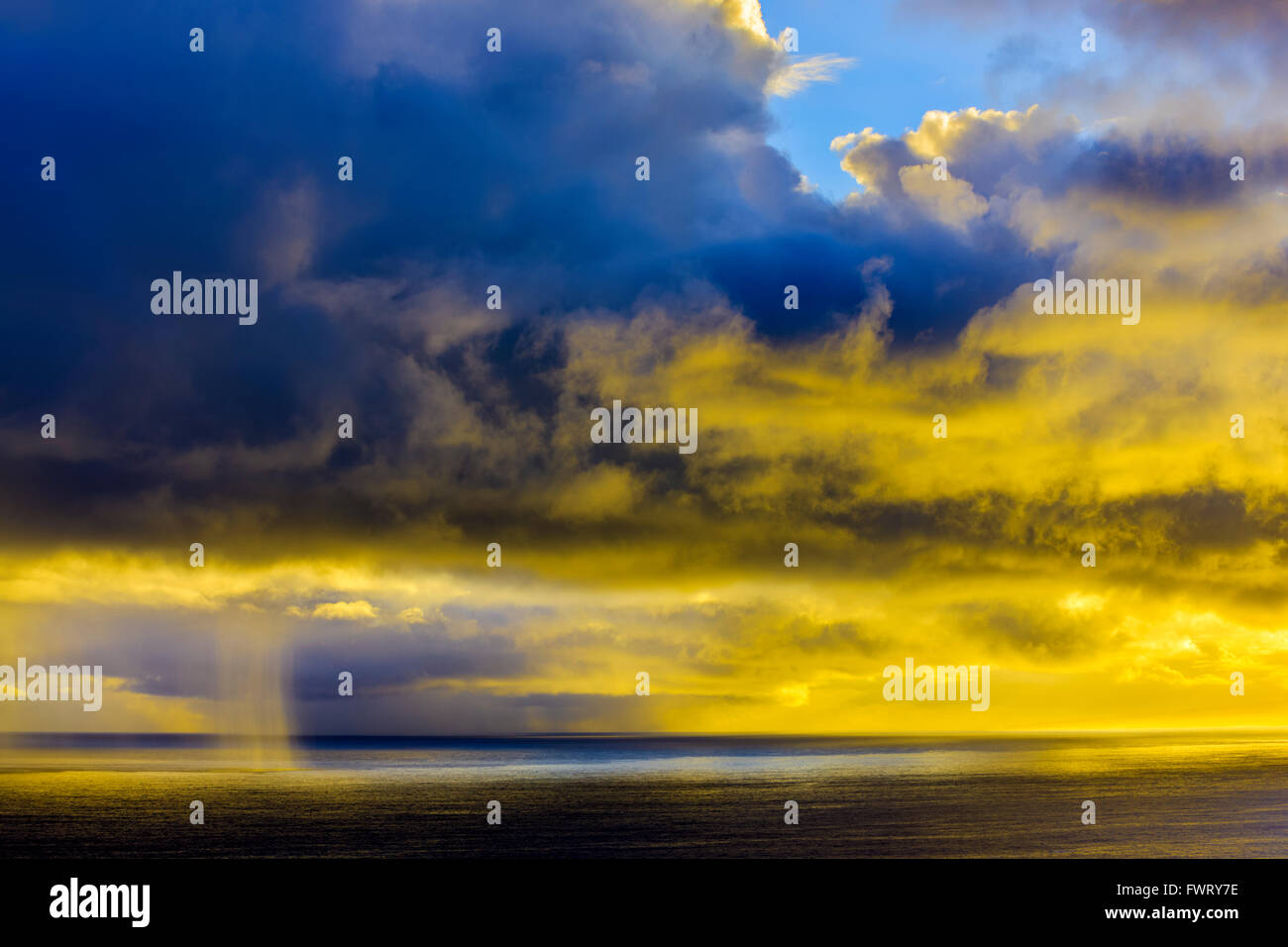 rain cell pouring over Pacific Ocean off the coast of Maui Hawaii Stock ...