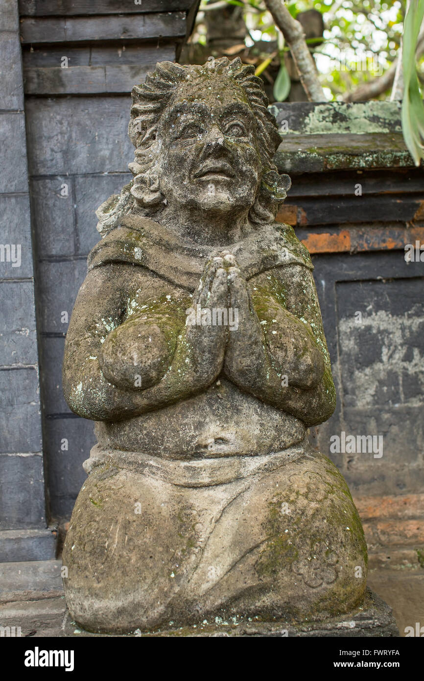 Traditional guard statue carved in stone on Bali island Stock Photo - Alamy