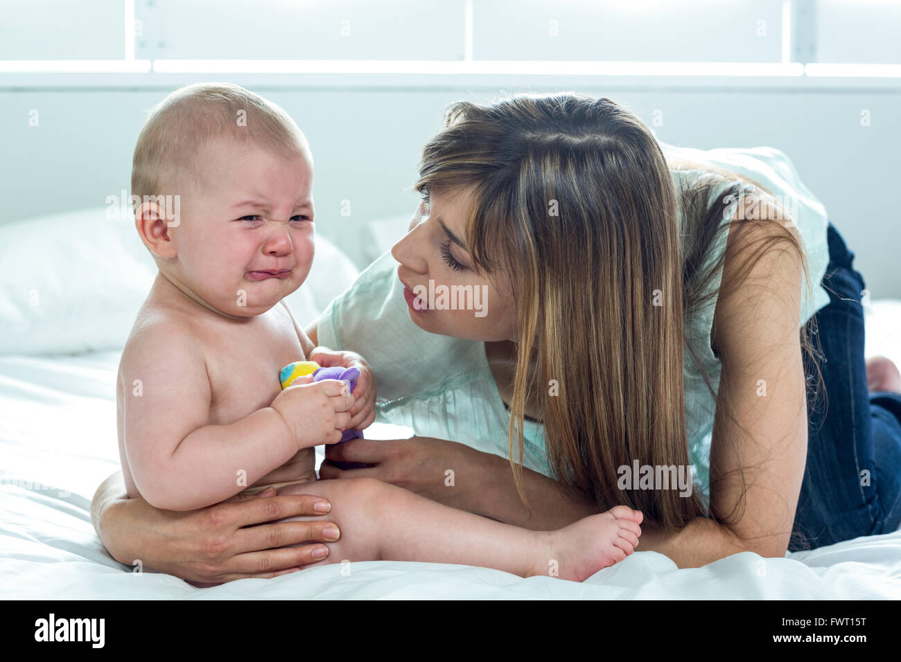 Crying mother baby bed hi-res stock photography and images - Alamy