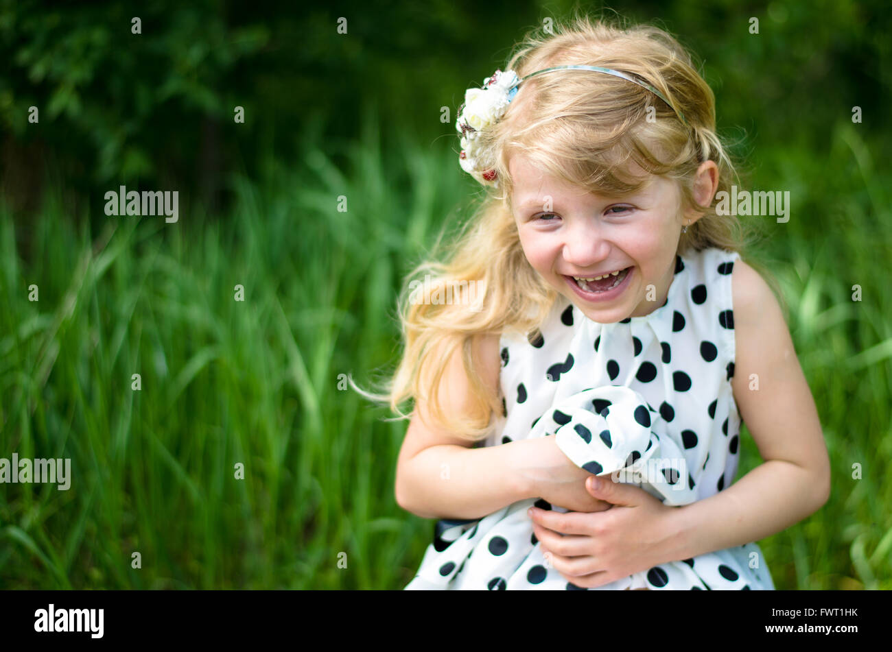 beautiful blond girl laughing loudly Stock Photo - Alamy
