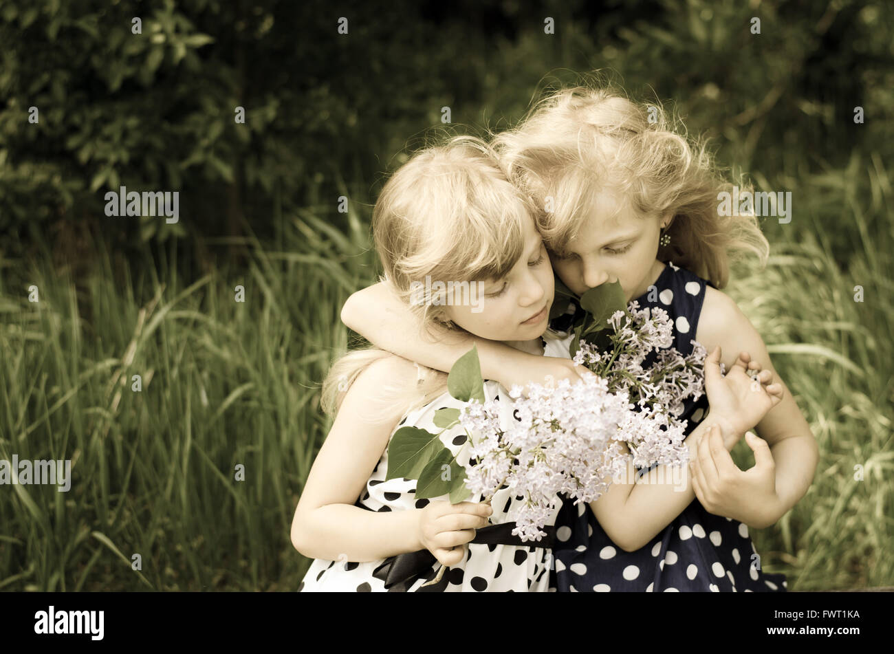Girls huging hi-res stock photography and images - Alamy