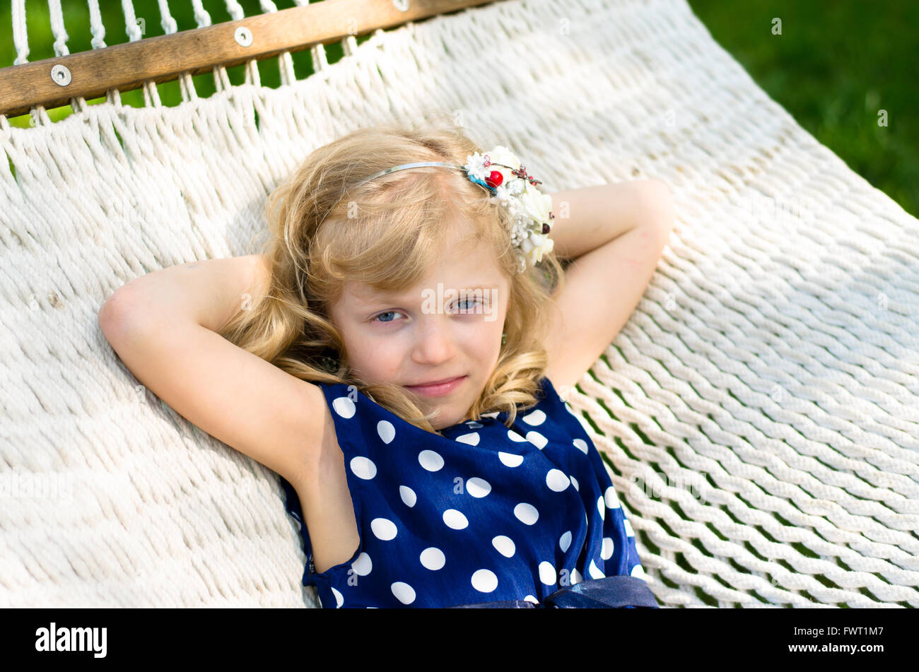 beautiful blond girl lying in hammock Stock Photo - Alamy