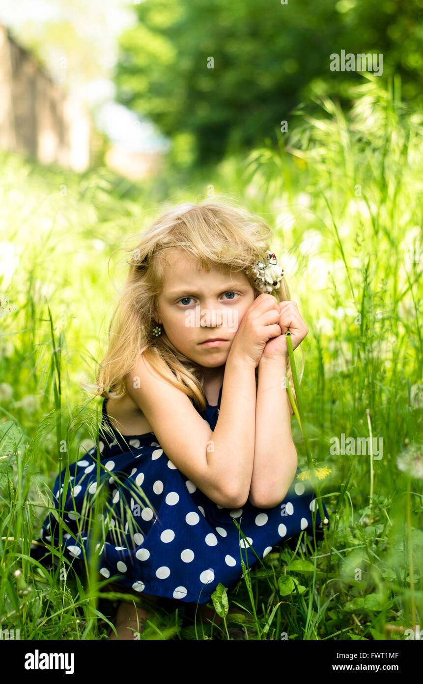 beautiful blond girl in green grass Stock Photo - Alamy