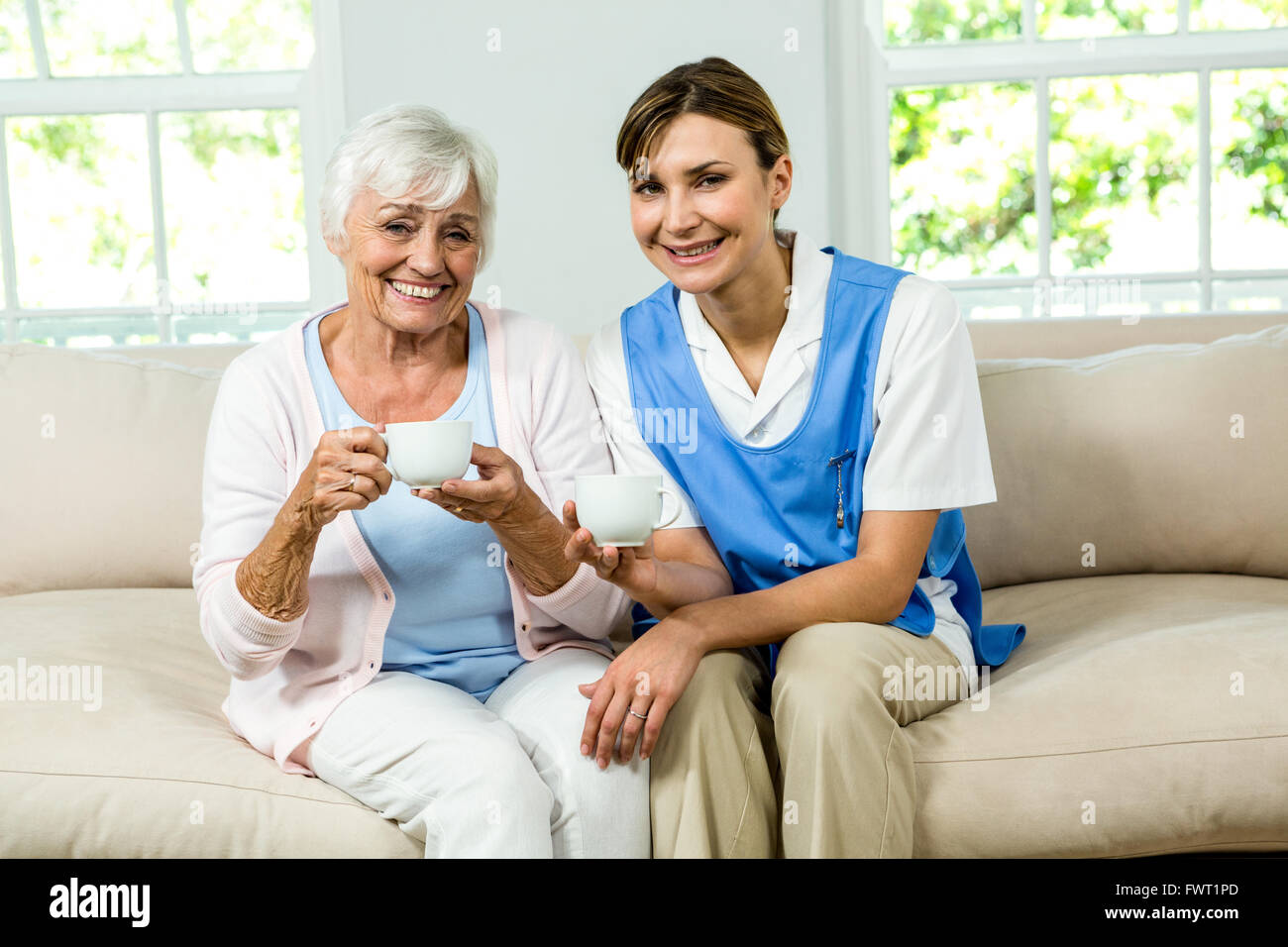 Portrait of smiling nurse with senior woman Stock Photo - Alamy