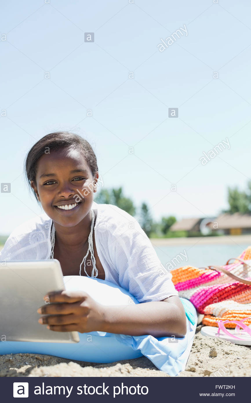Tablet on beach hi-res stock photography and images - Alamy