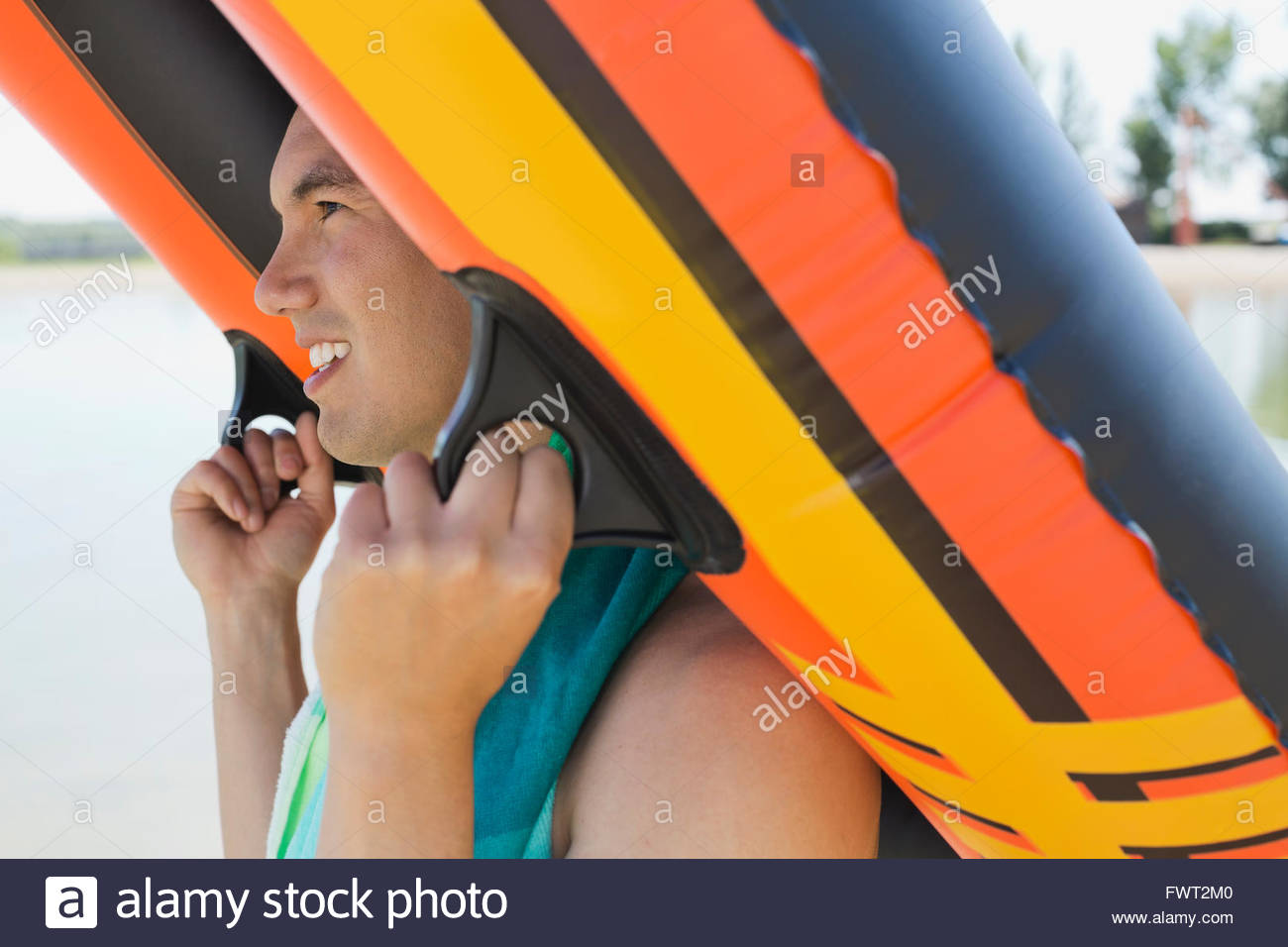 Man carrying raft hi-res stock photography and images - Alamy