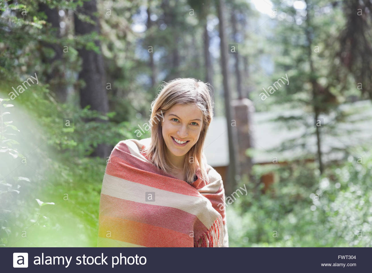 Portrait of woman wrapped in a blanket Stock Photo - Alamy
