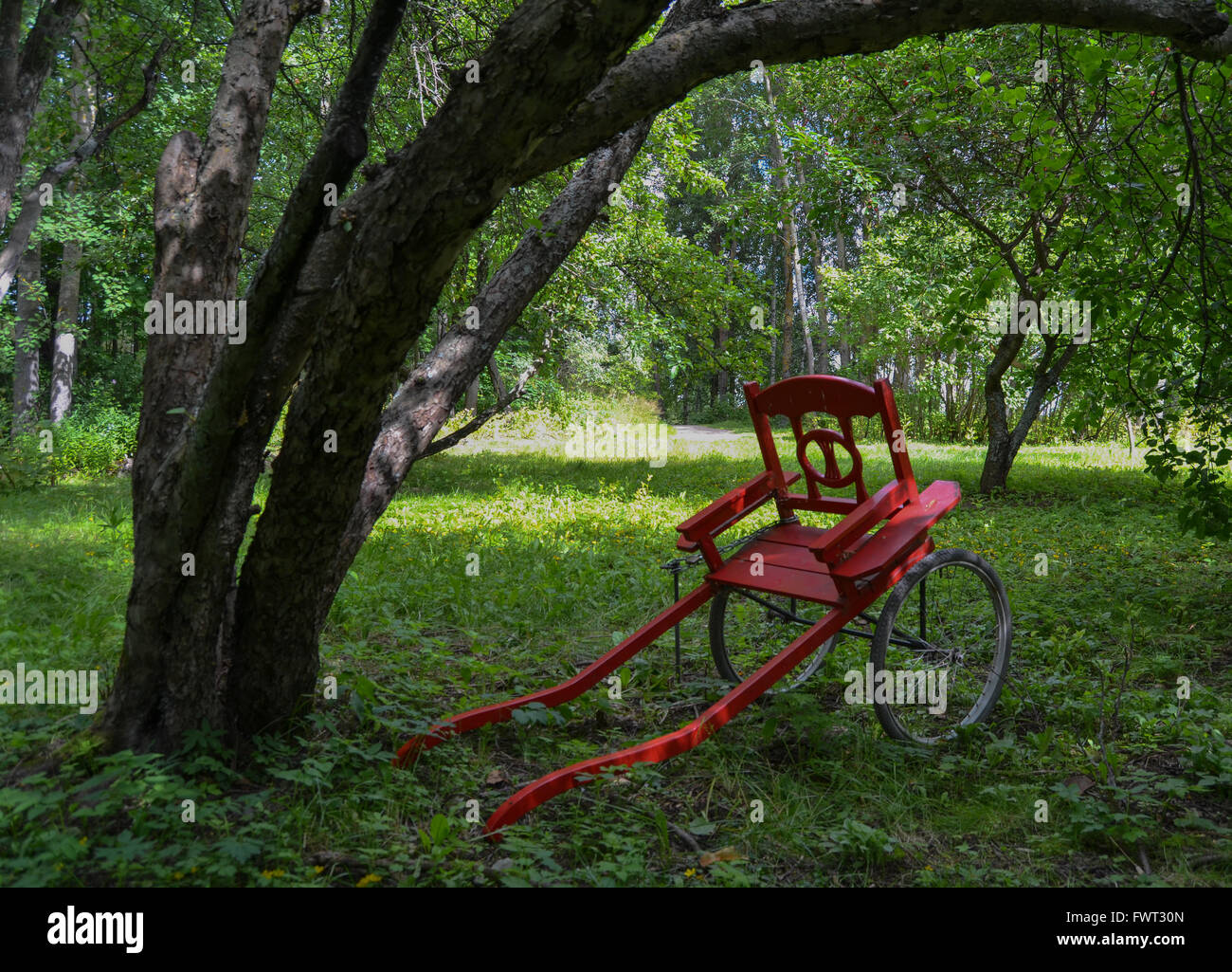 Old red horse buggies as a garden ornament, Tuusula Finland Stock Photo ...