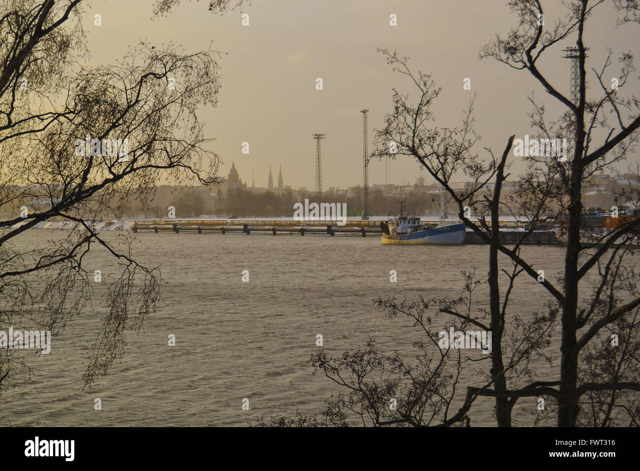 A boat and pier in the winter before the sea freezes Stock Photo - Alamy