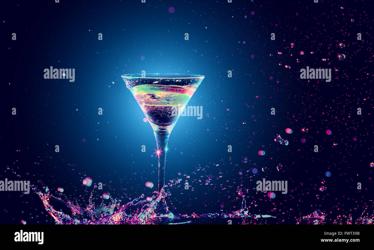 Colourful cocktail in glass with splash on the dark background Stock ...