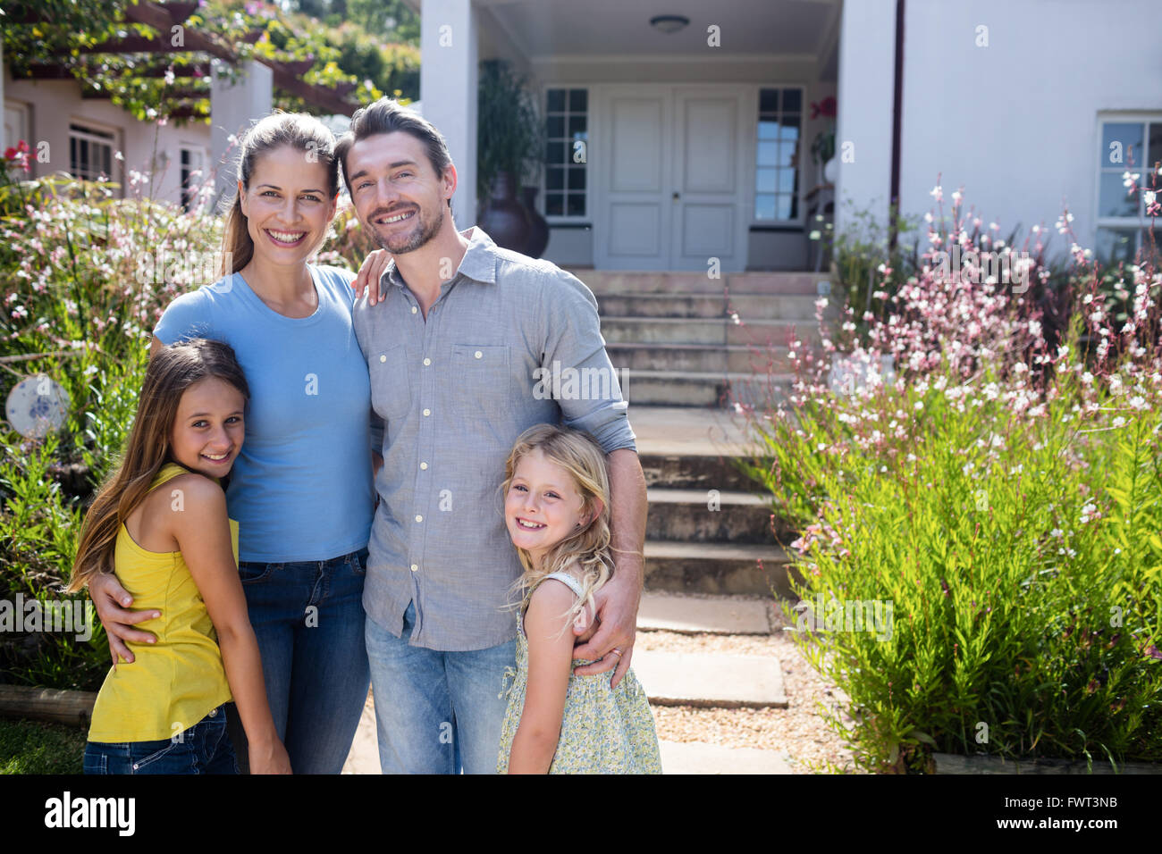 Portrait of family standing together Stock Photo - Alamy