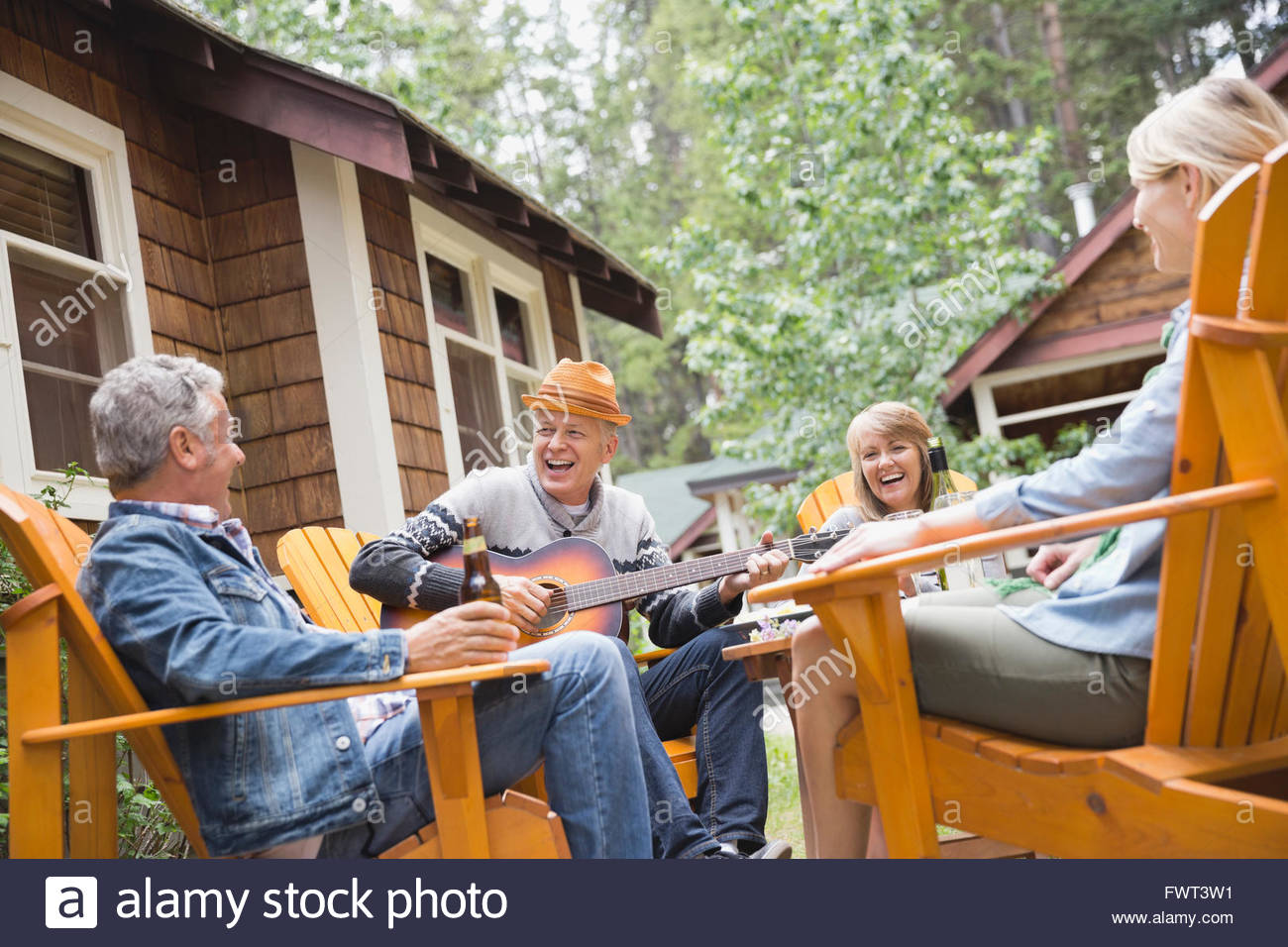 Middle-aged friends spending leisure time at the cabin Stock Photo - Alamy