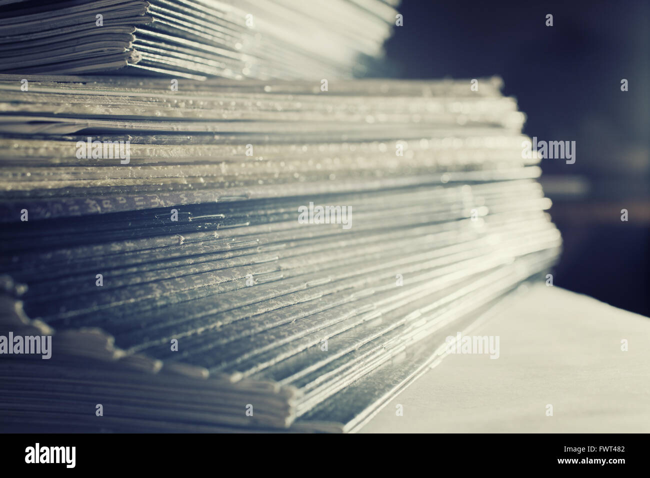 Large stack of magazines on table close-up Stock Photo - Alamy