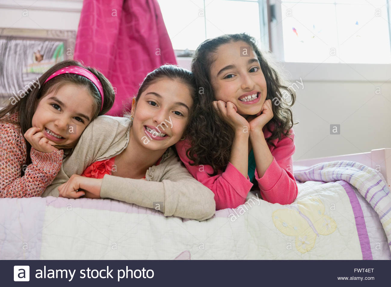 Portrait three sisters lying on hi-res stock photography and images - Alamy