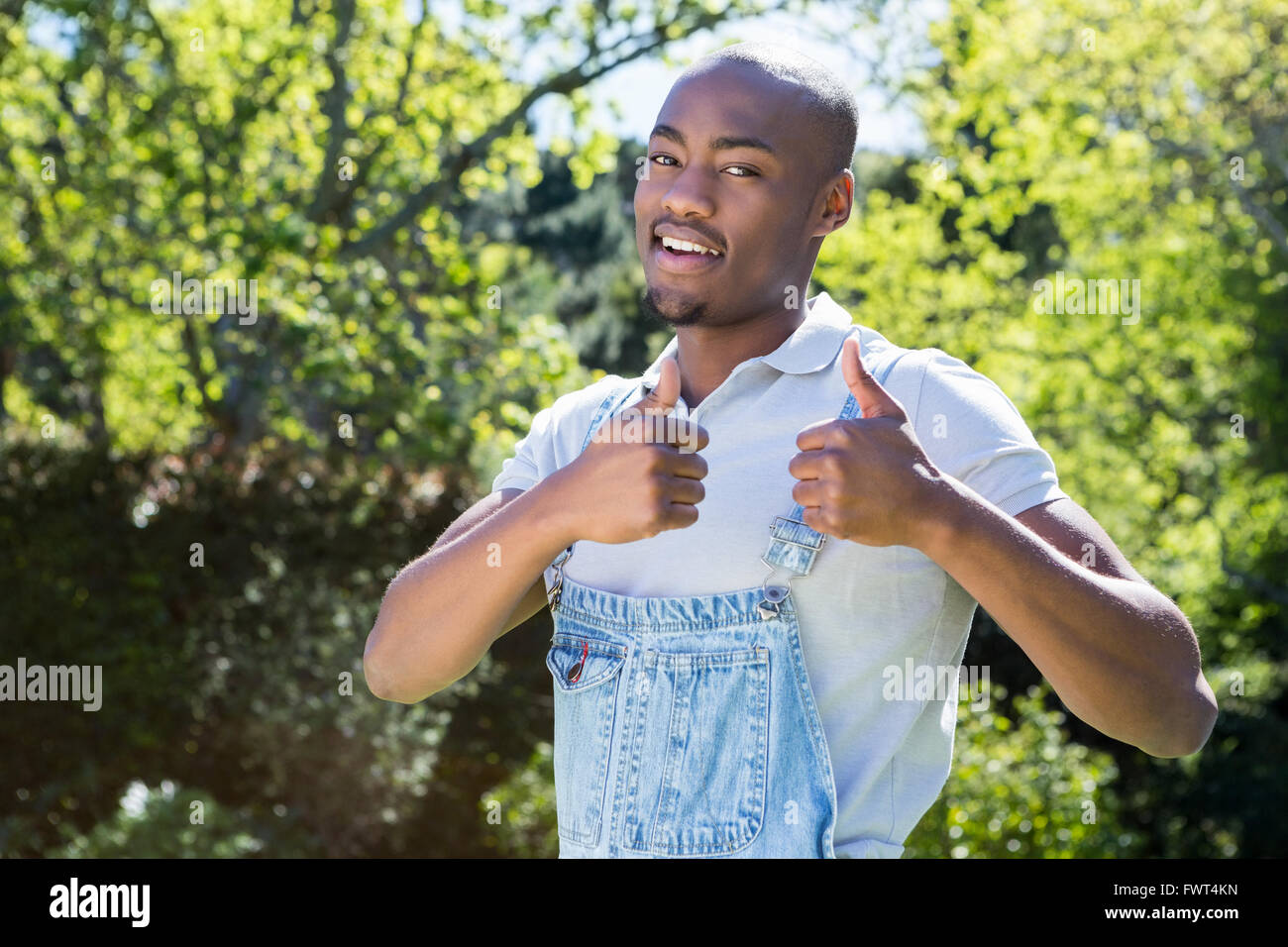 Young man standing in garden Stock Photo - Alamy