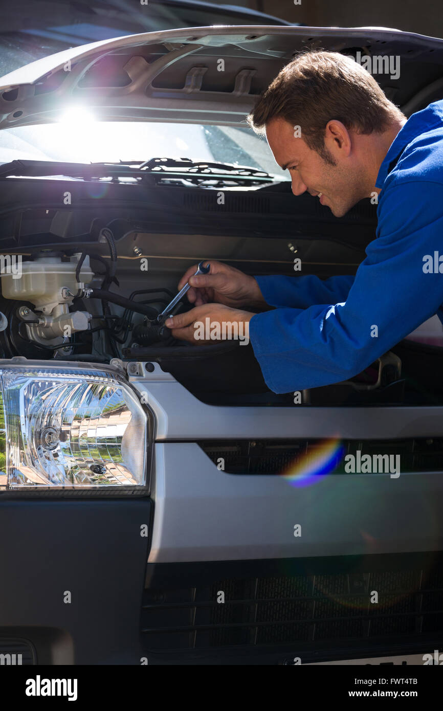 Mechanic examining the car Stock Photo - Alamy