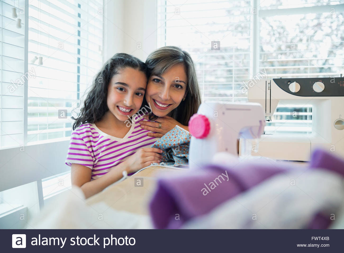 Girls together sewing hi-res stock photography and images - Alamy
