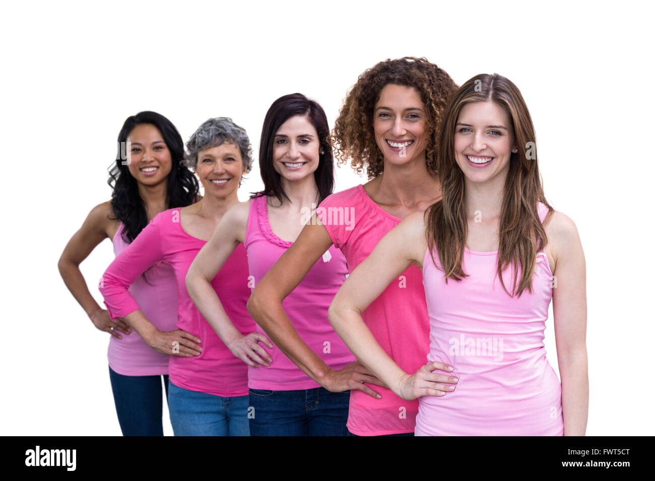 Smiling women in pink outfits posing for breast cancer awareness Stock ...