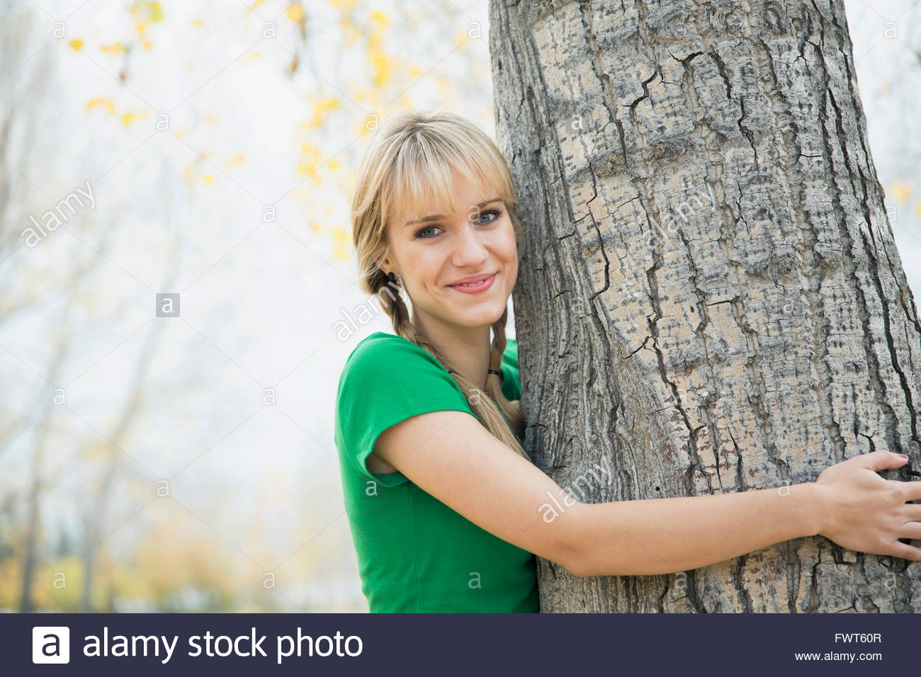 Woman tree hugger hi-res stock photography and images - Alamy