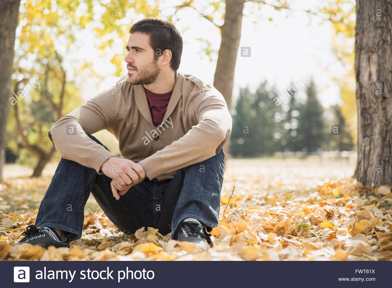 Hands together on knees hi-res stock photography and images - Alamy