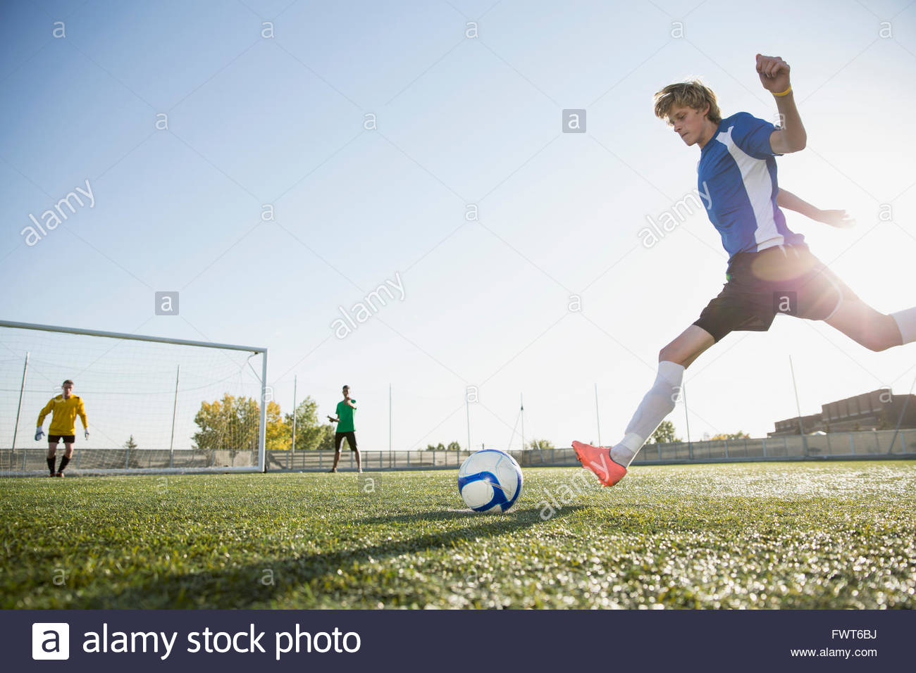 Ball kick full length hi-res stock photography and images - Alamy