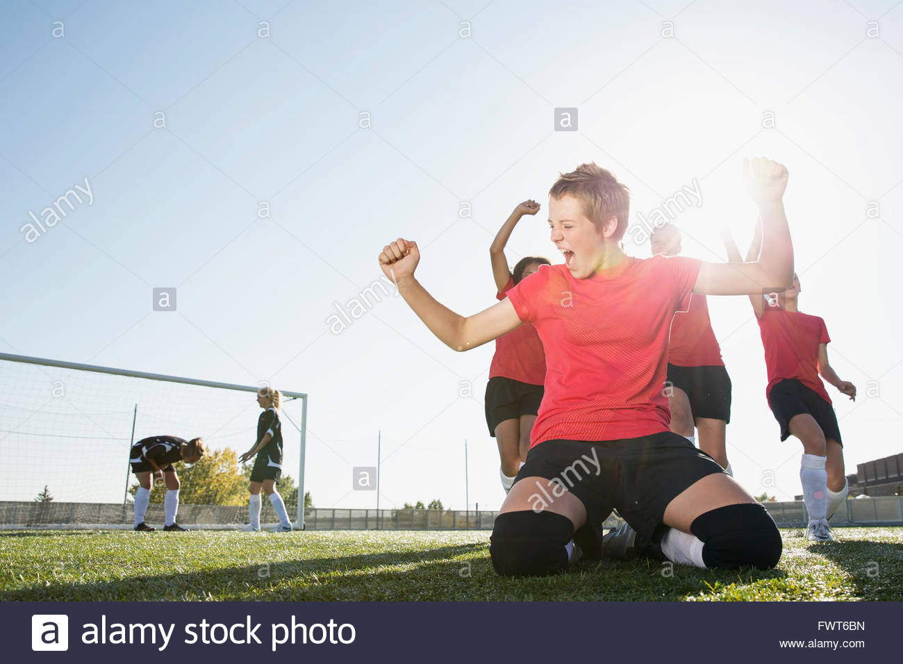 Girl cheering win hi-res stock photography and images - Alamy