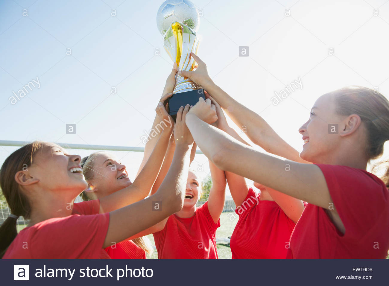 Girls lifting trophy hi-res stock photography and images - Alamy