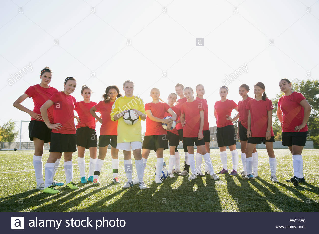 Girls soccer team lined up on field Stock Photo - Alamy