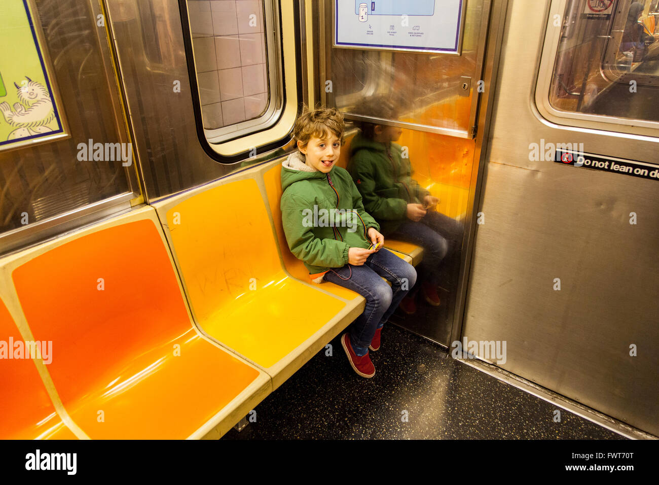 Six year old boy in a Subway train carriage, Manhattan, New York City ...