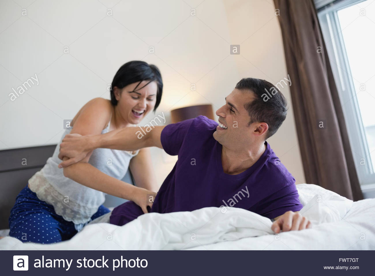 Two women touching playful hi-res stock photography and images - Alamy