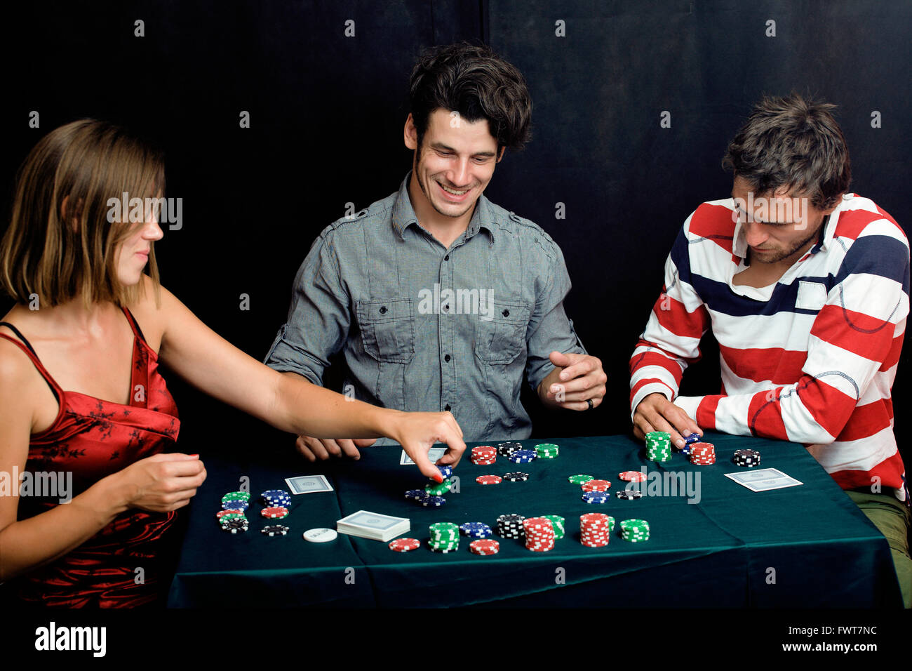 young people playing poker off-line tournament, friends party concept ...