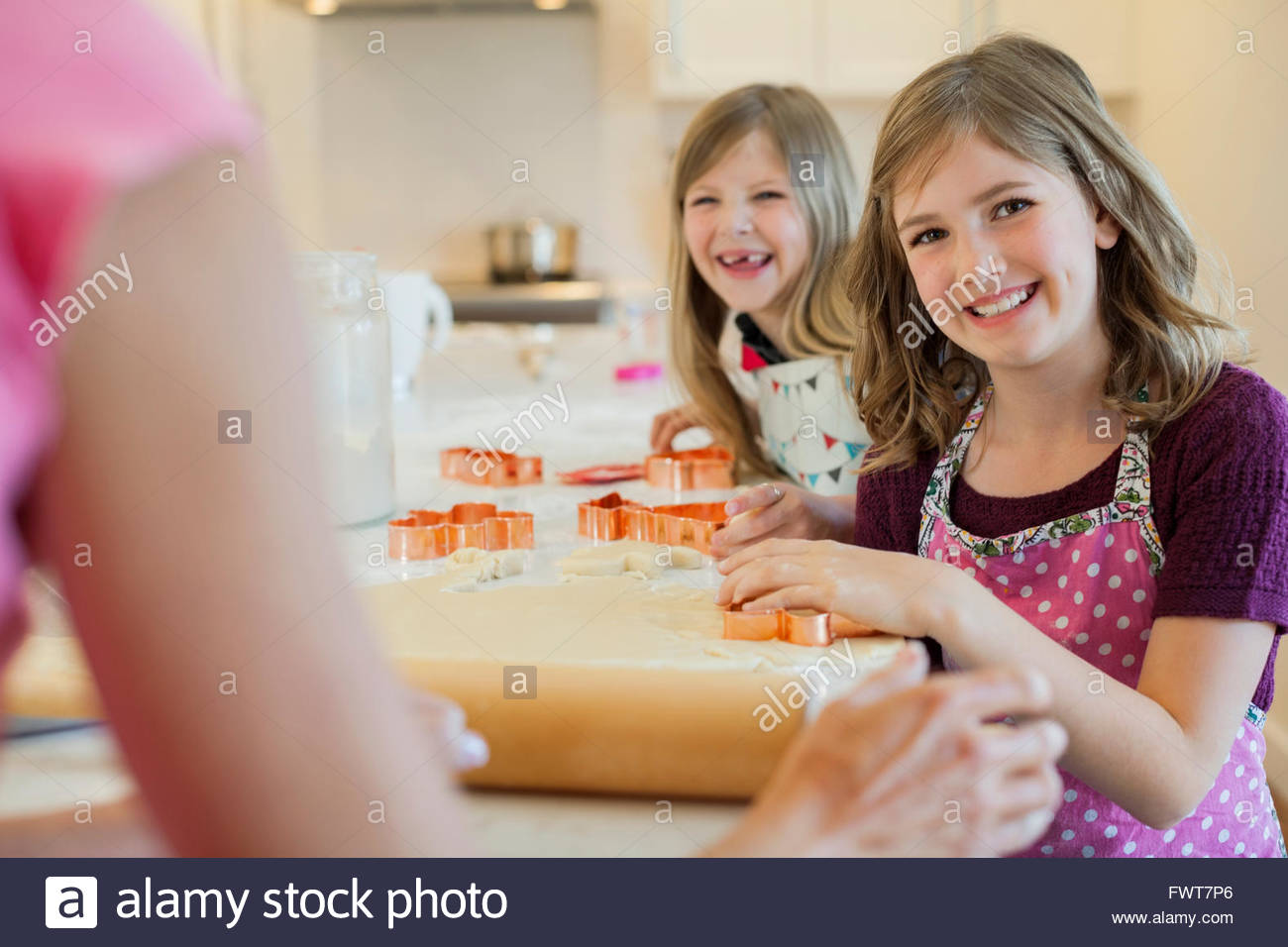 Girls making cookies Stock Photo - Alamy