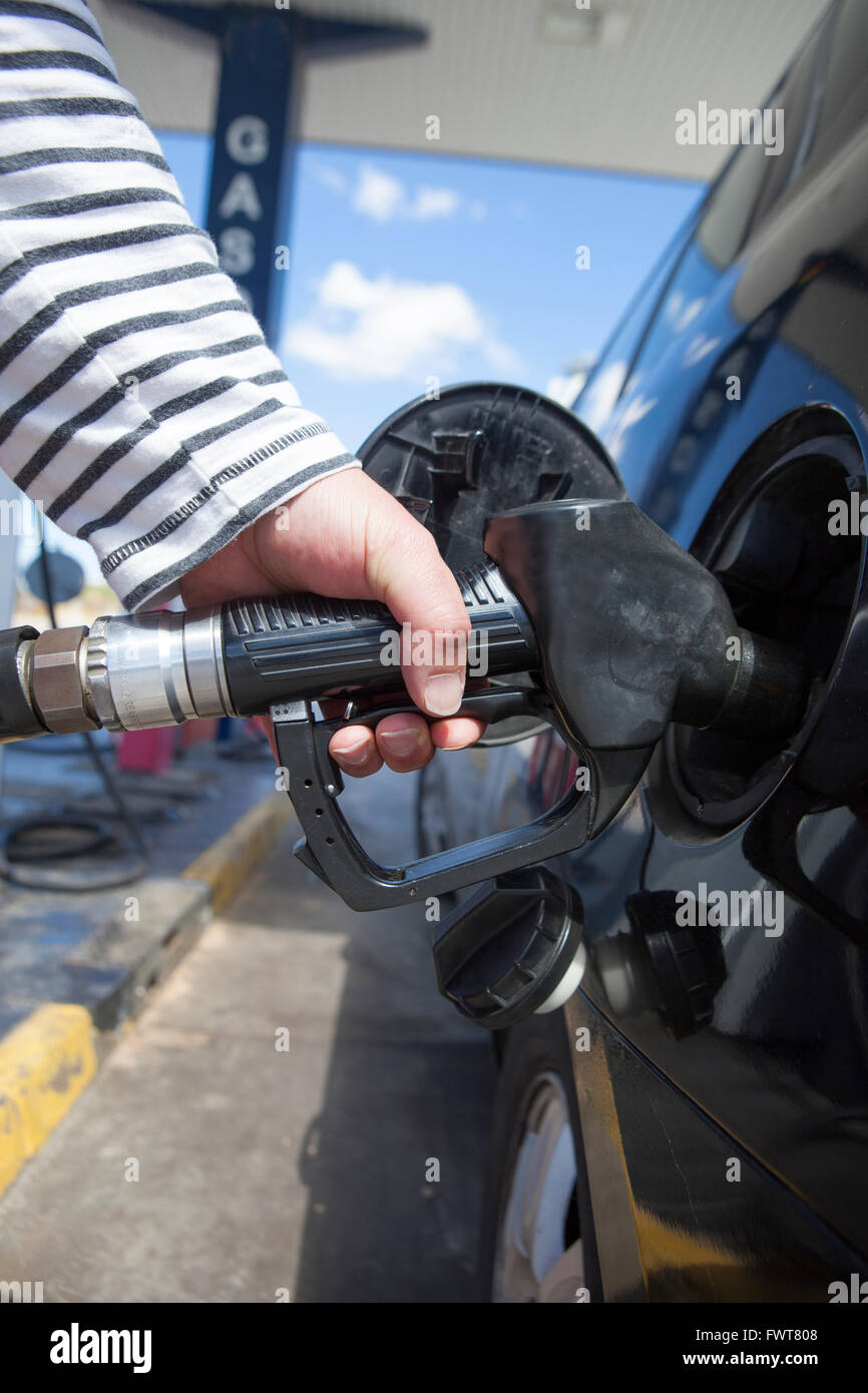 Man pumping gasoline fuel in car at gas station Stock Photo - Alamy