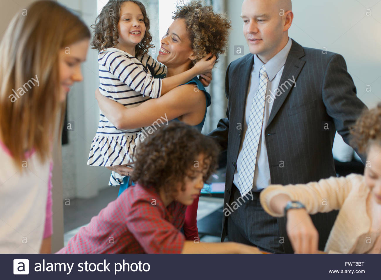 Mother and father saying goodbye before going out Stock Photo - Alamy