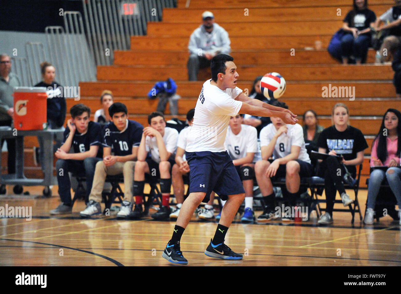 Player bracing to return a serve and begin a volley during a high ...